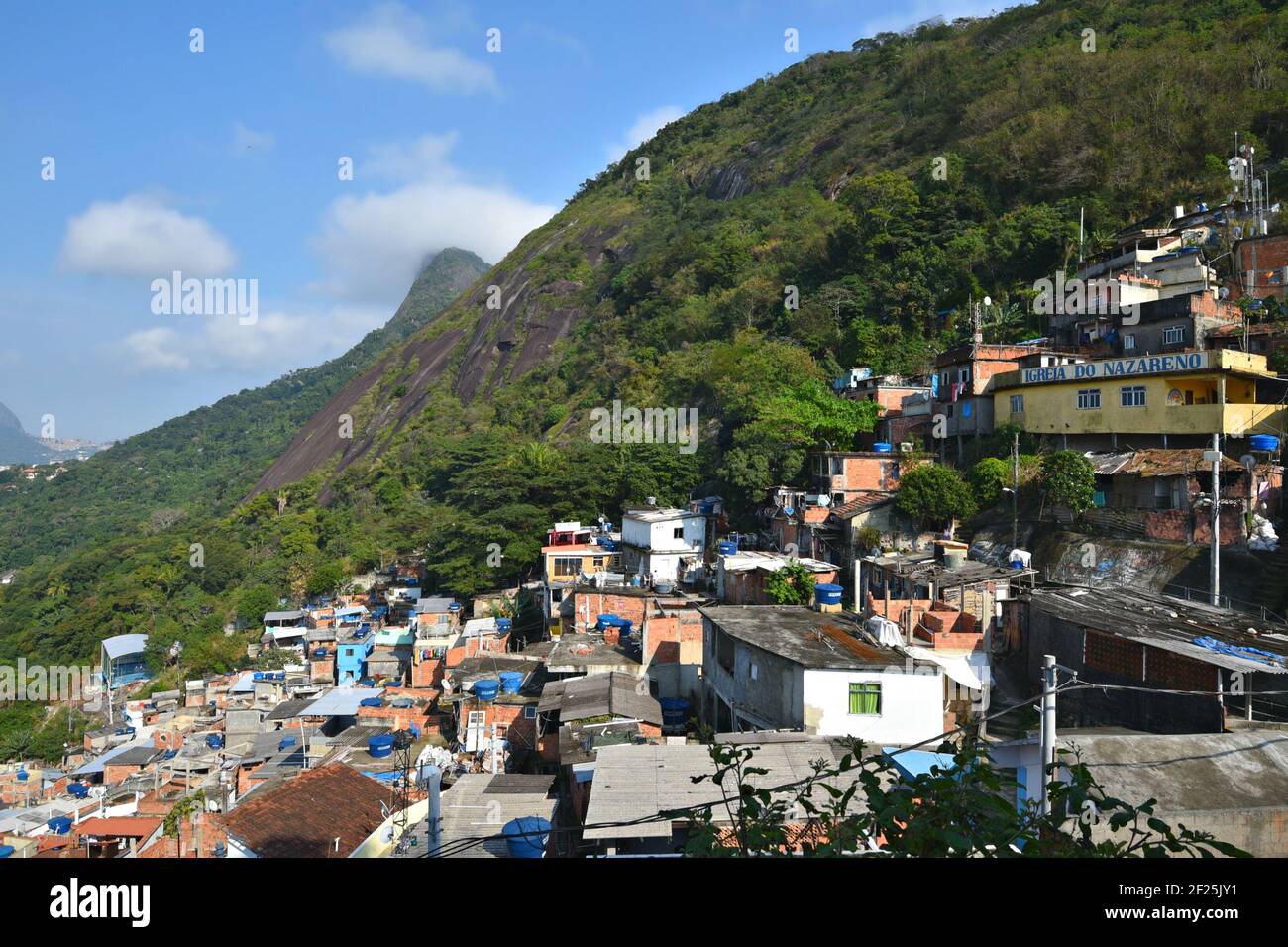 Typical hillside favela houses and local church at the Santa Marta ...