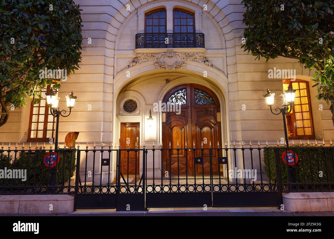 Traditional French house with typical balconies and windows at night ...