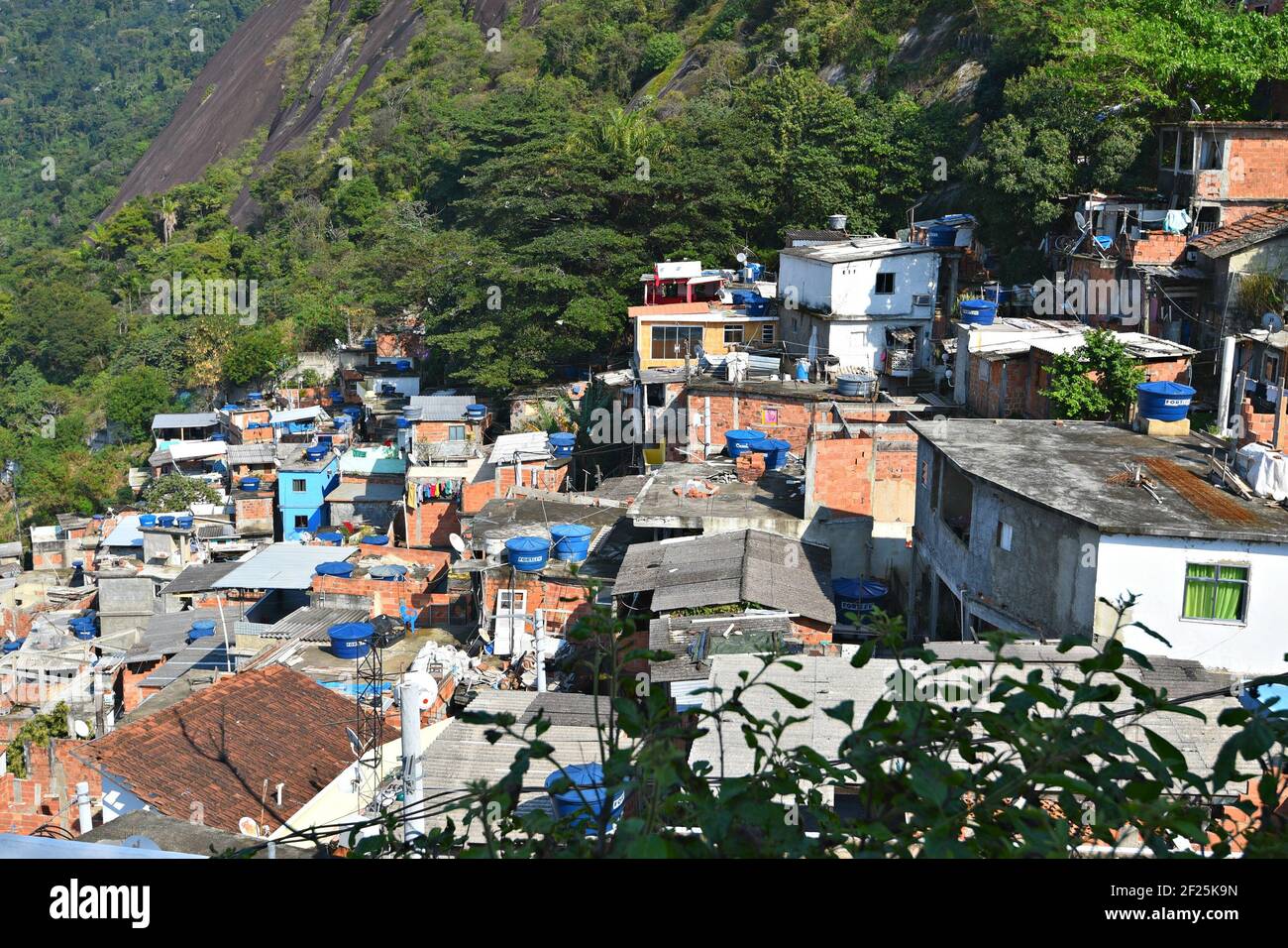 Typical hillside favela houses and local church at the Santa Marta ...