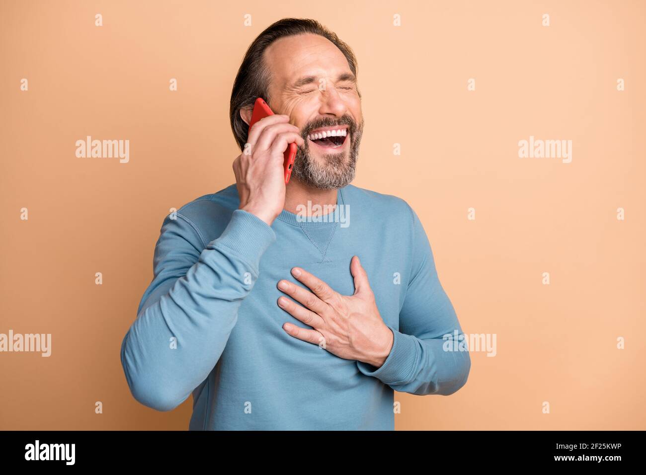 Photo portrait of happy man talking on cellphone laughing loudly hand ...