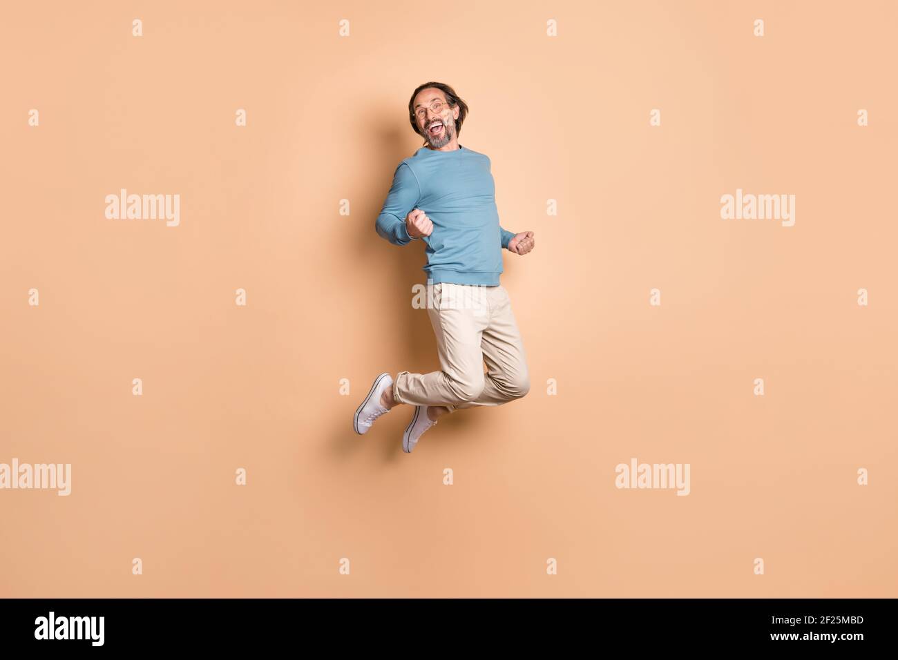 Full length photo of champion man jump wear eyewear blue pullover pants ...