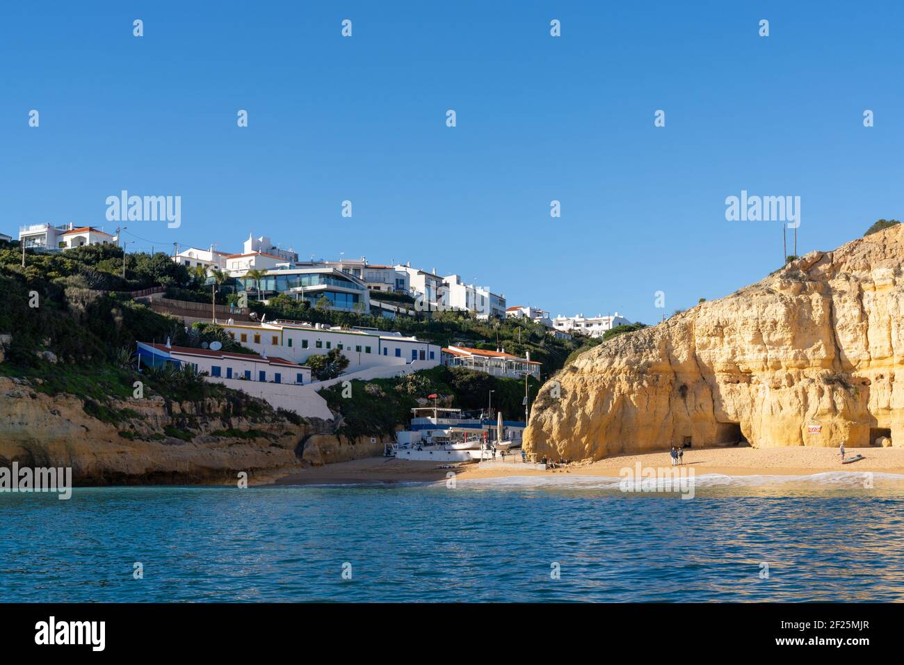The beach town of Benagil on the Algarve coast of Portugal Stock Photo ...