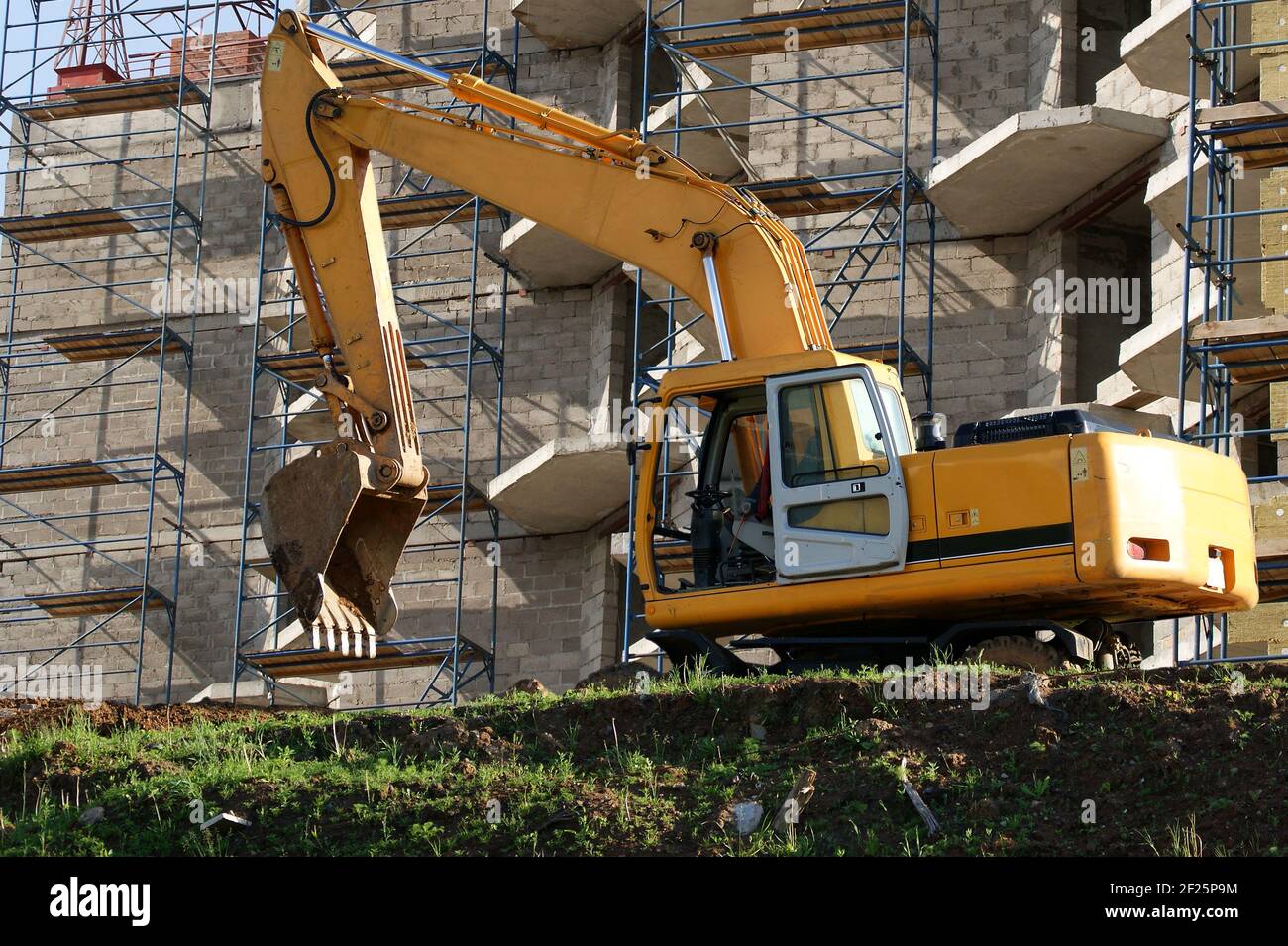Heavy buildind excavator in front of building site , Moscow, Russia ...