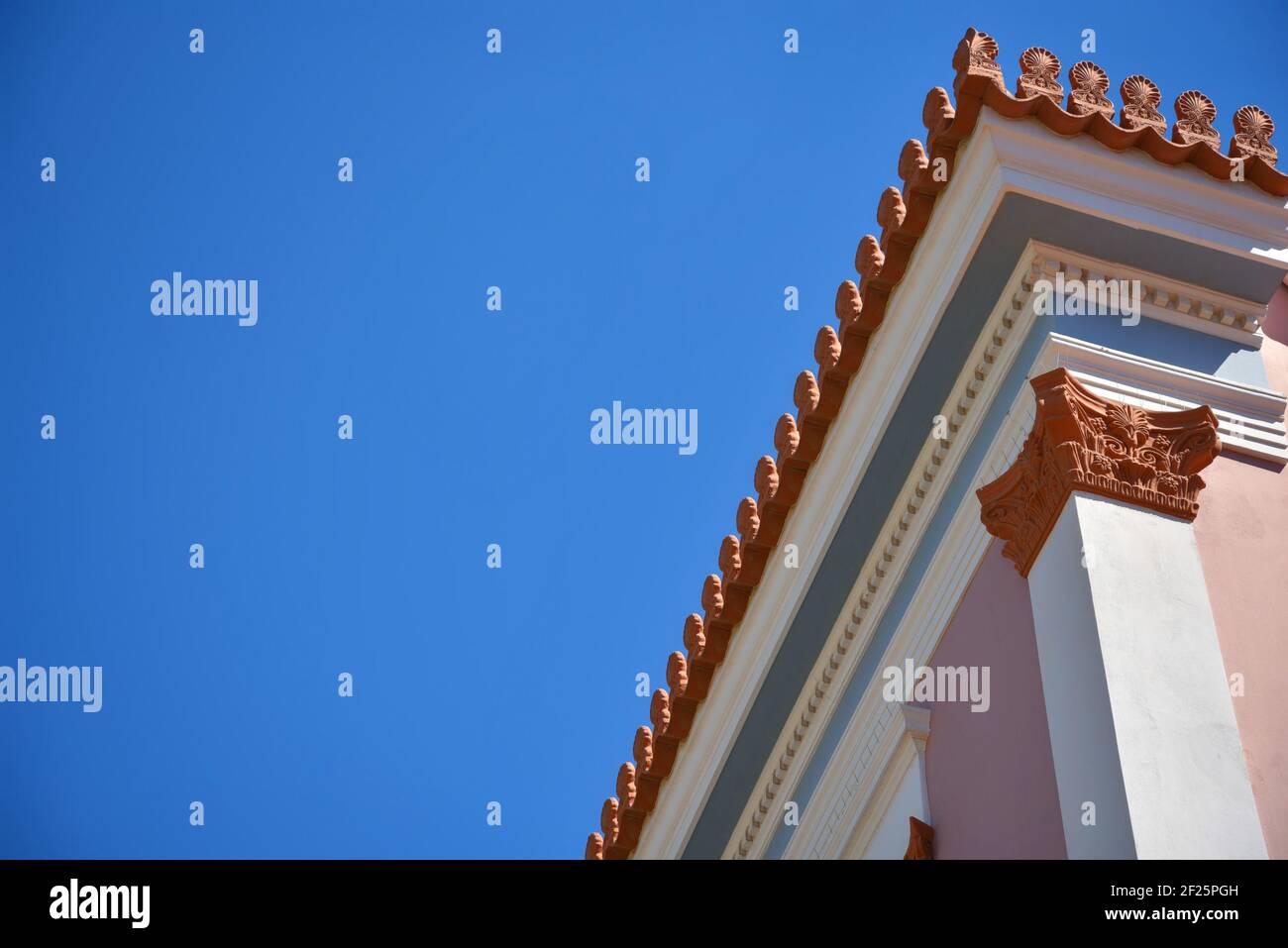Neoclassical building partial facade view with red clay Antefix ...
