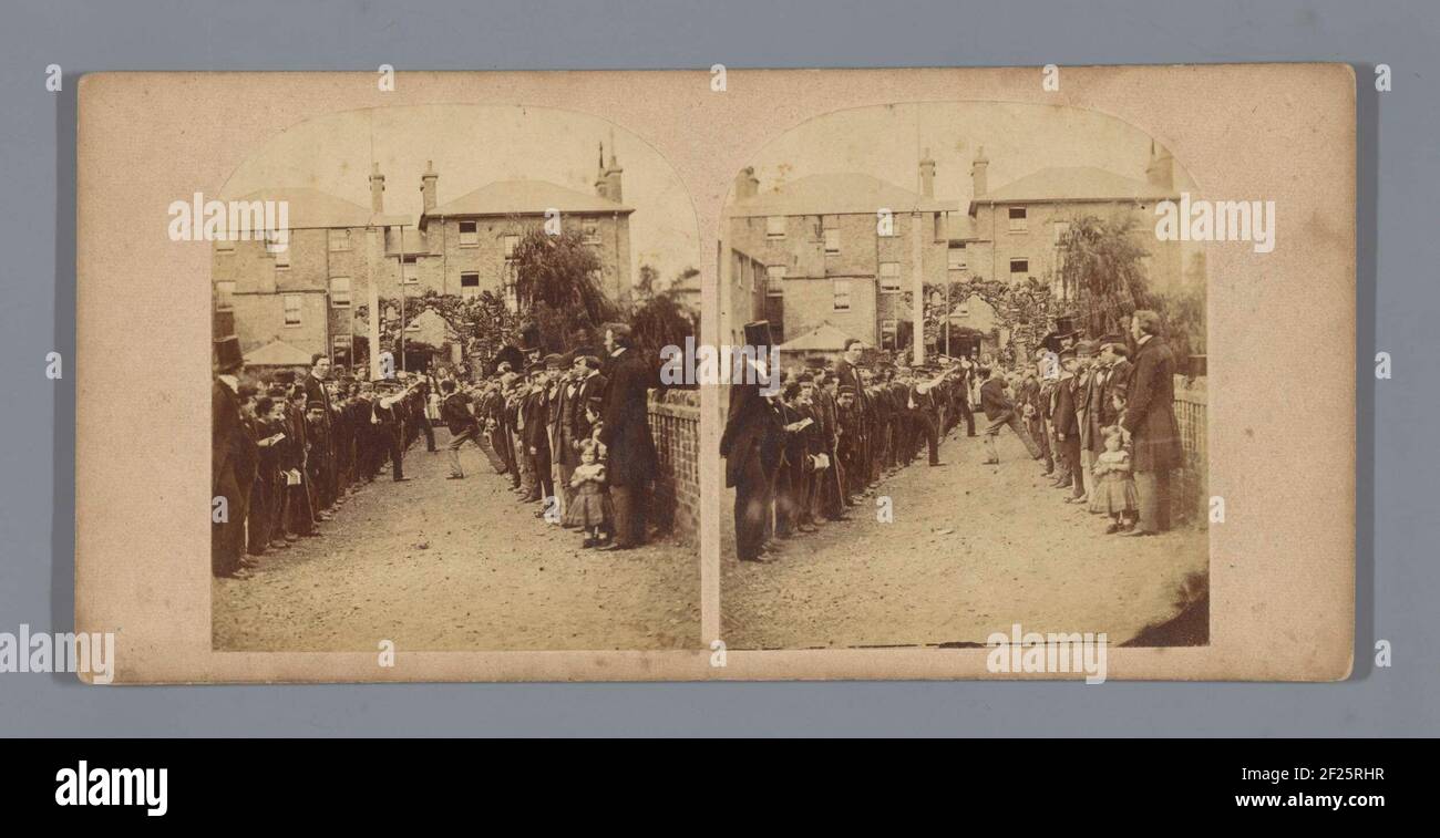 Wedding couple under an arb bow between a hedge of people Stock Photo ...