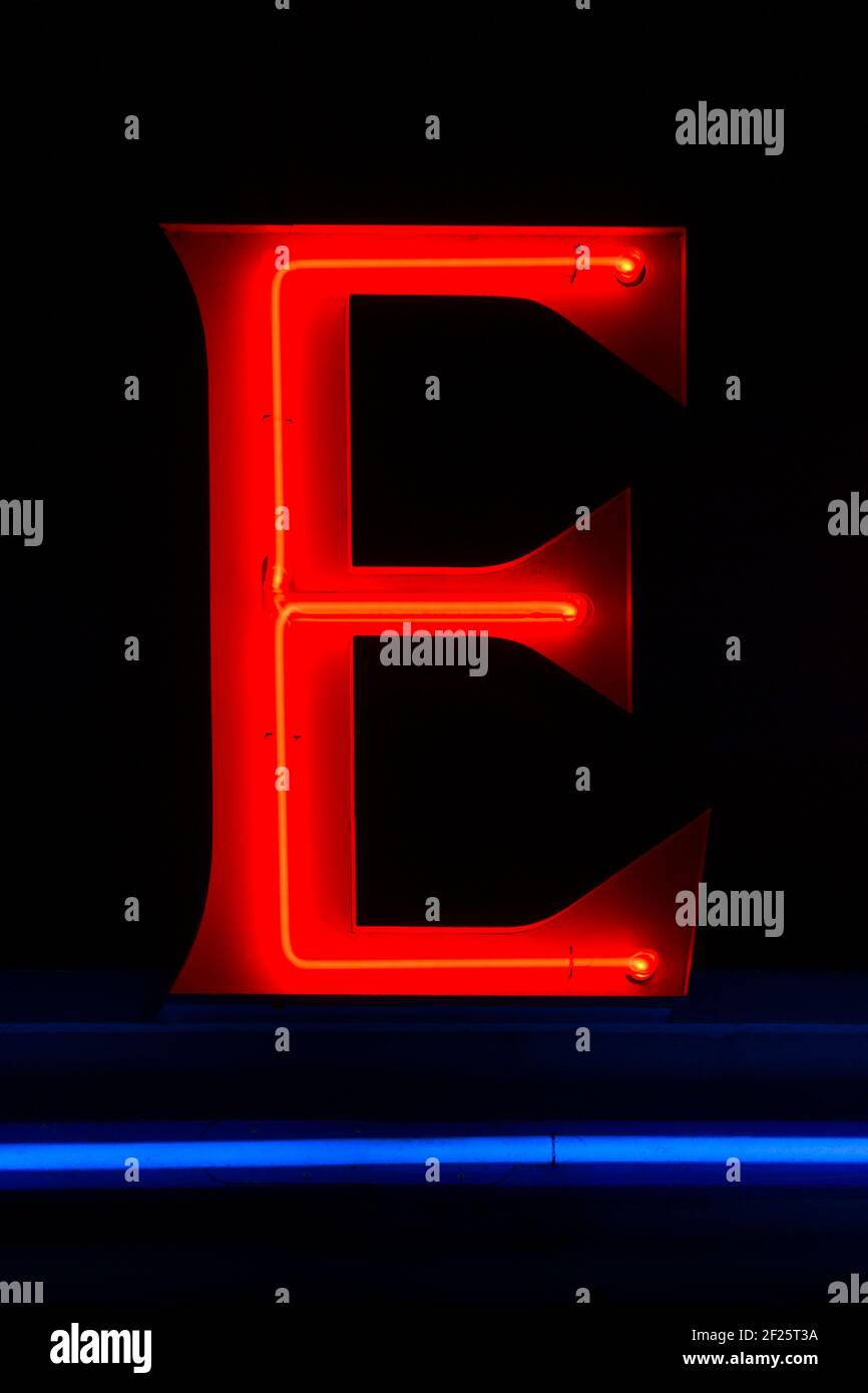 Red glowing neon letter E at night with blue underline Stock Photo - Alamy