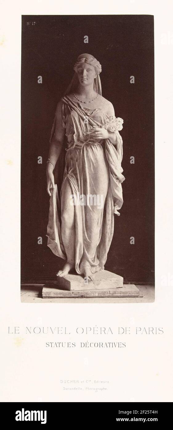 Marble image of a woman in robe and a veil over her head, in her left ...