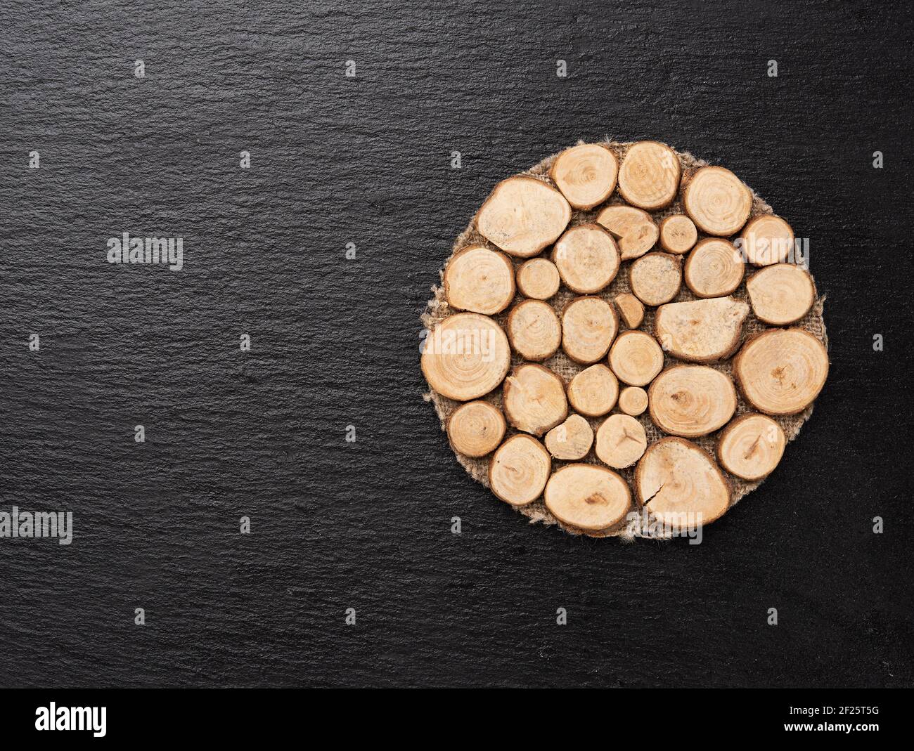 Round wooden stand on black surface, top view Stock Photo - Alamy