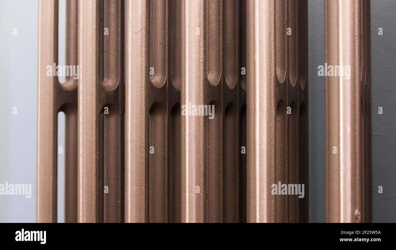 Close up section of cast iron radiator for use as background Stock ...