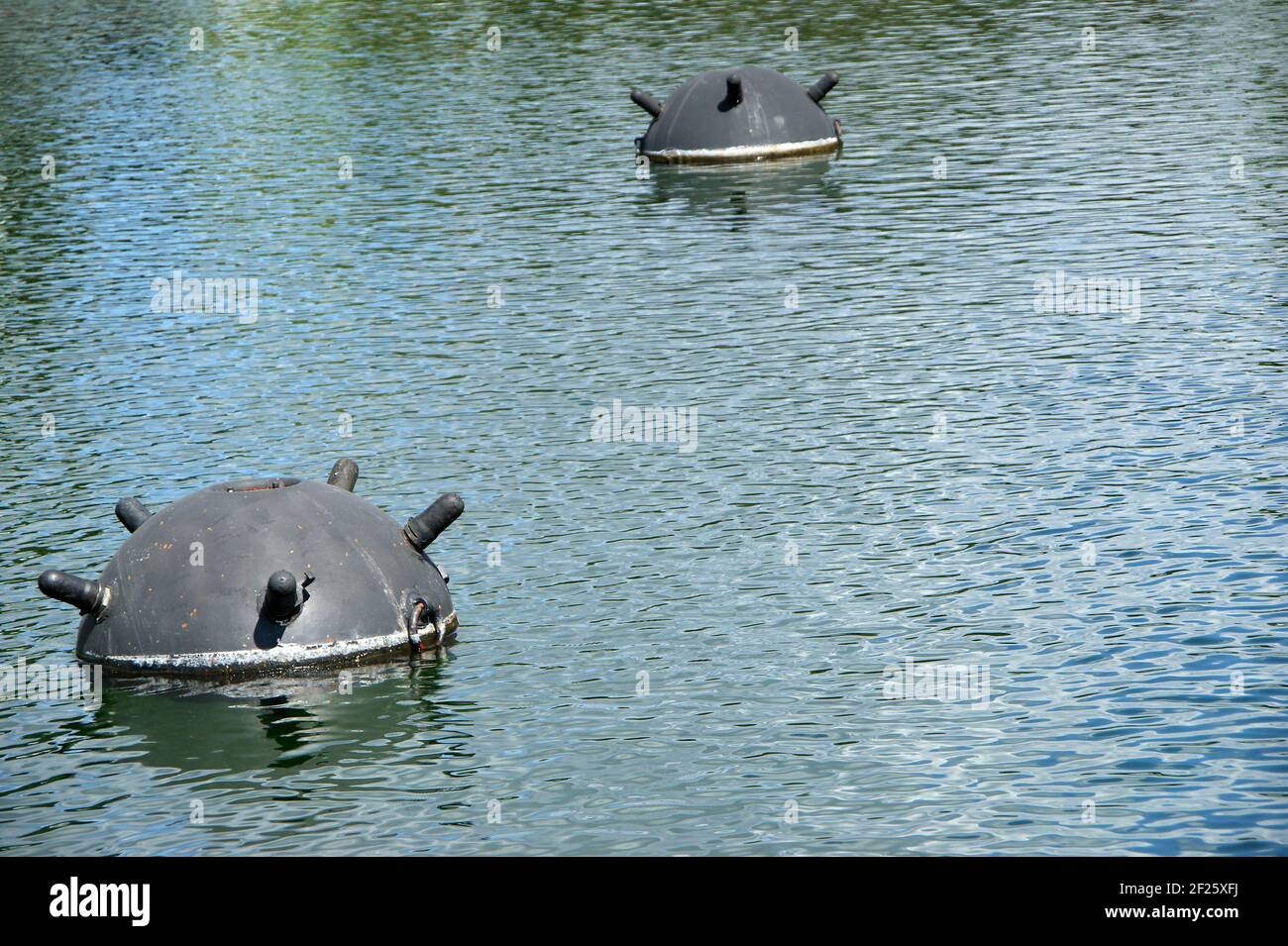 Large naval mines on the surface Stock Photo - Alamy