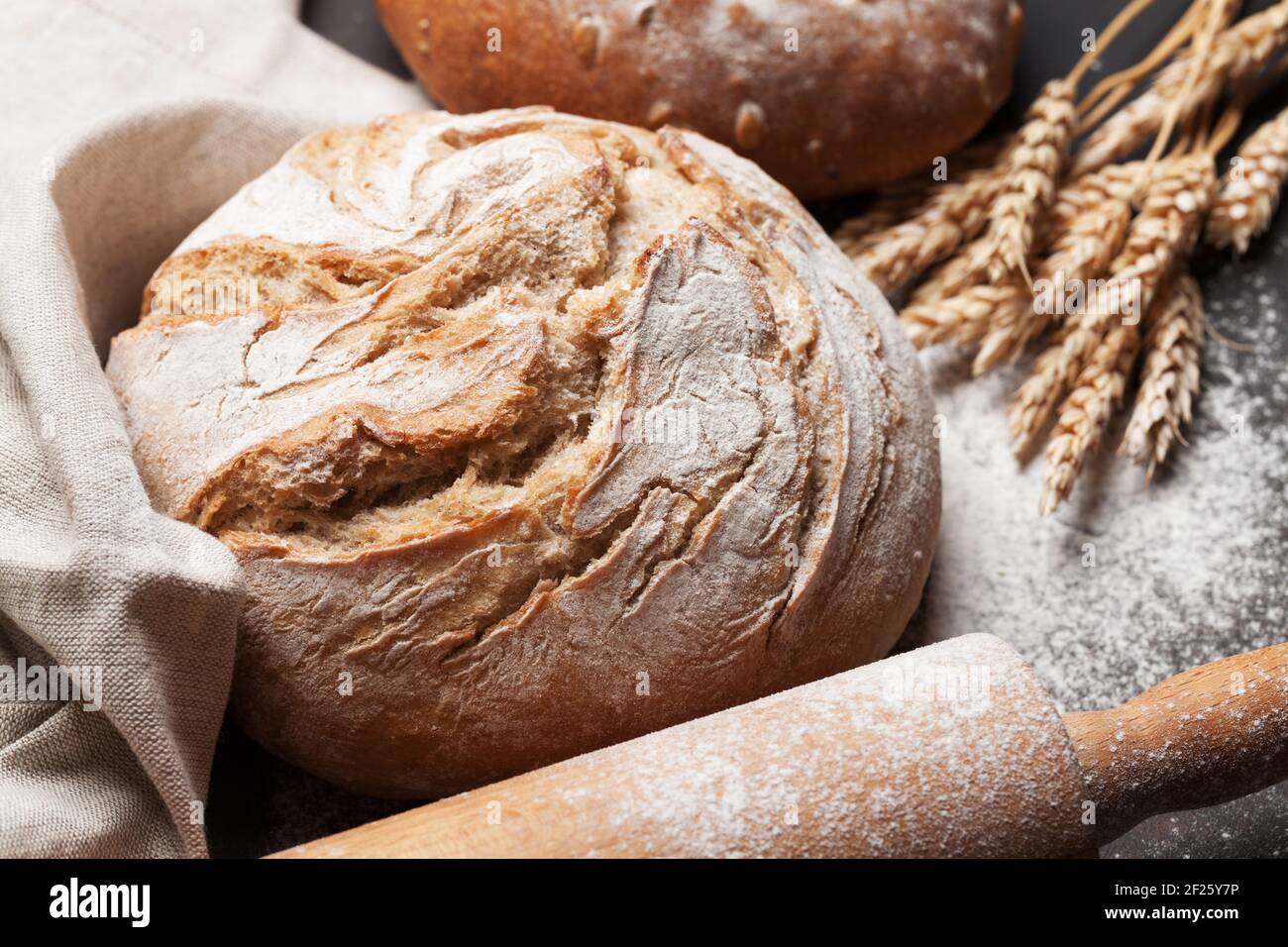 Homemade crusty bread cooking on blackboard background Stock Photo - Alamy