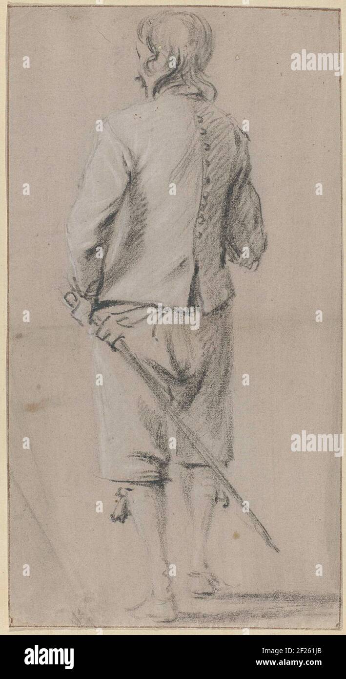 Standing man with sword, seen on the back Stock Photo - Alamy
