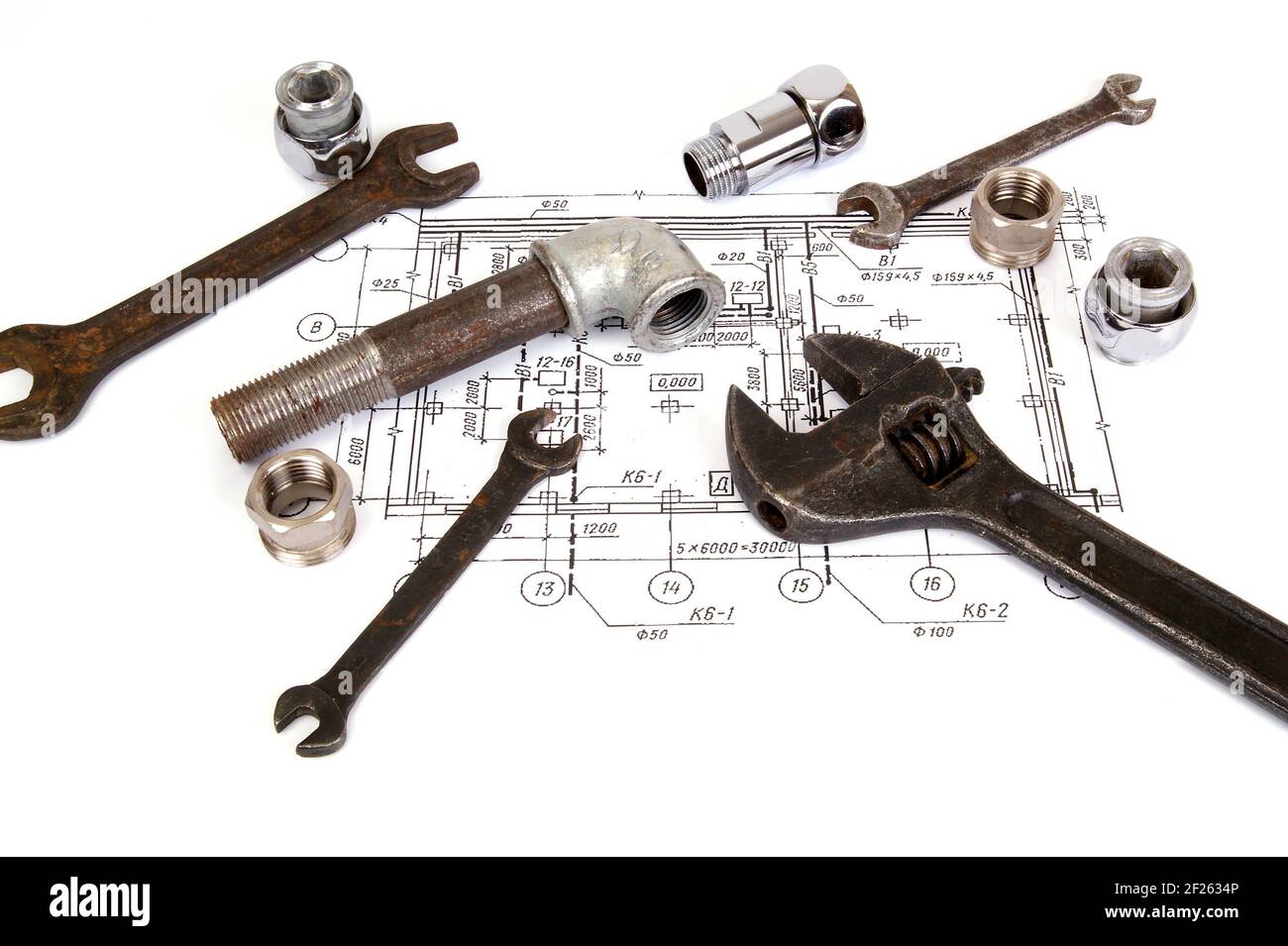 Plumbing parts and tools on the drawing, close-up Stock Photo - Alamy