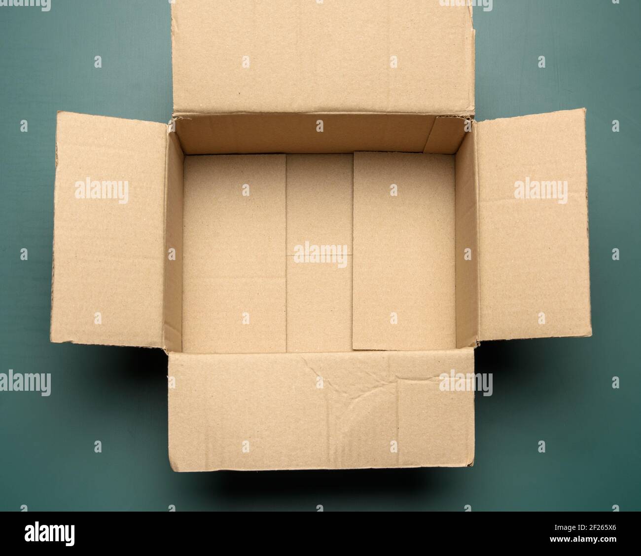 Open empty cardboard rectangular box made of corrugated brown paper on ...