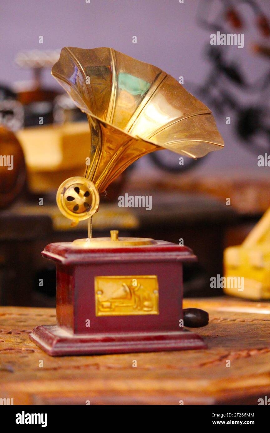 Old gramophone with horn speaker over plates Stock Photo - Alamy