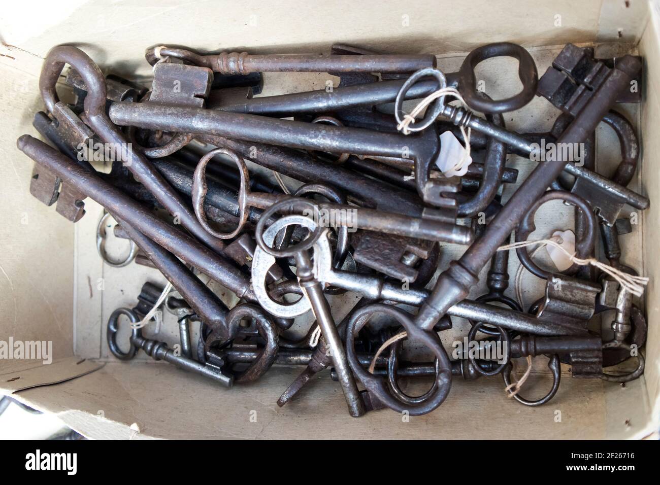 A bunch of antique keys in a box at a flea market Stock Photo - Alamy