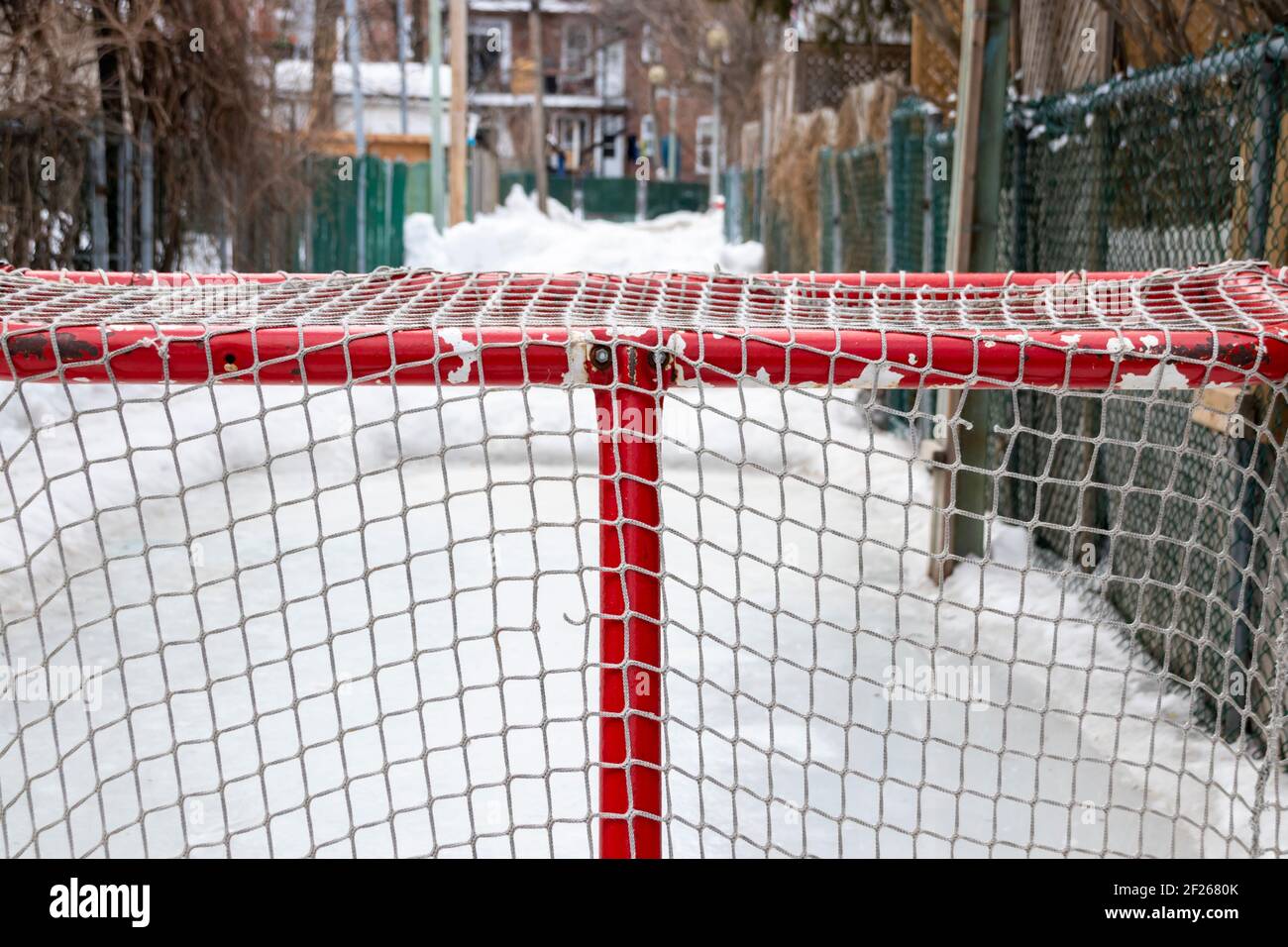 Close up on a Hockey goal and homemade small ice ring for kids in a ...