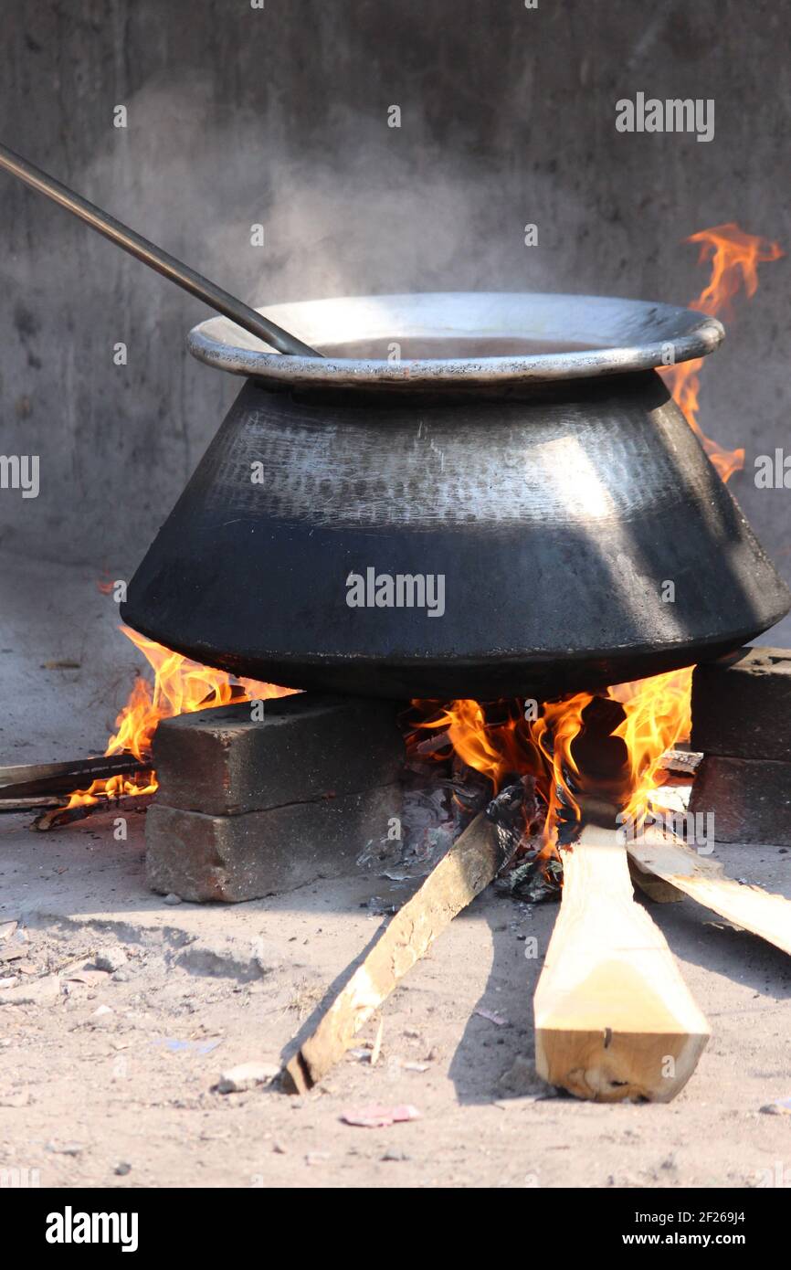 traditional food prepared at the cauldron on the open fire with wood ...