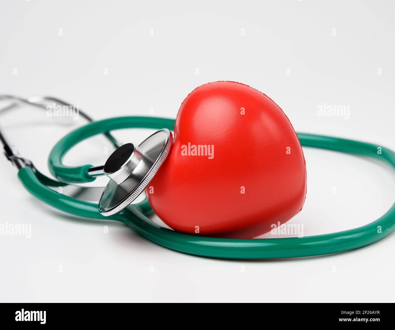 Medical stethoscope and red rubber heart on white background Stock ...
