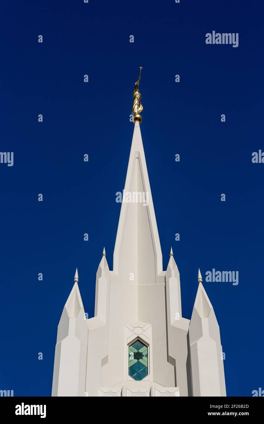 Temple spires and gold statue against blue sky Stock Photo - Alamy