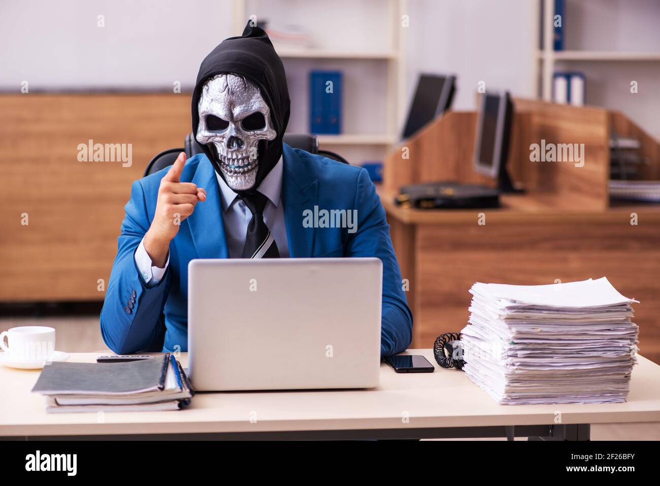 Devil businessman working in the office Stock Photo - Alamy