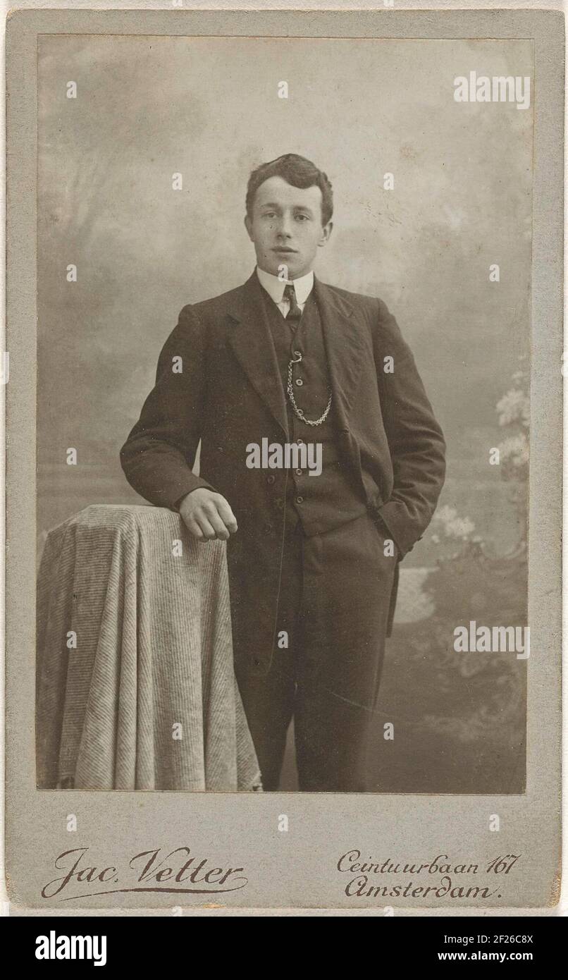 Studio portrait of a young man standing Stock Photo - Alamy