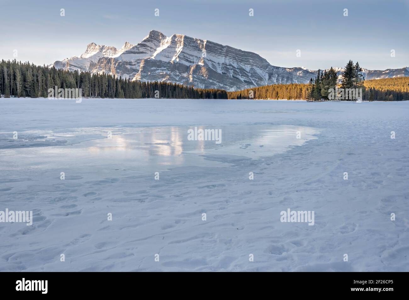 Ice reflection of Mount Rundle in Two Jack Lake in Banff National Park ...