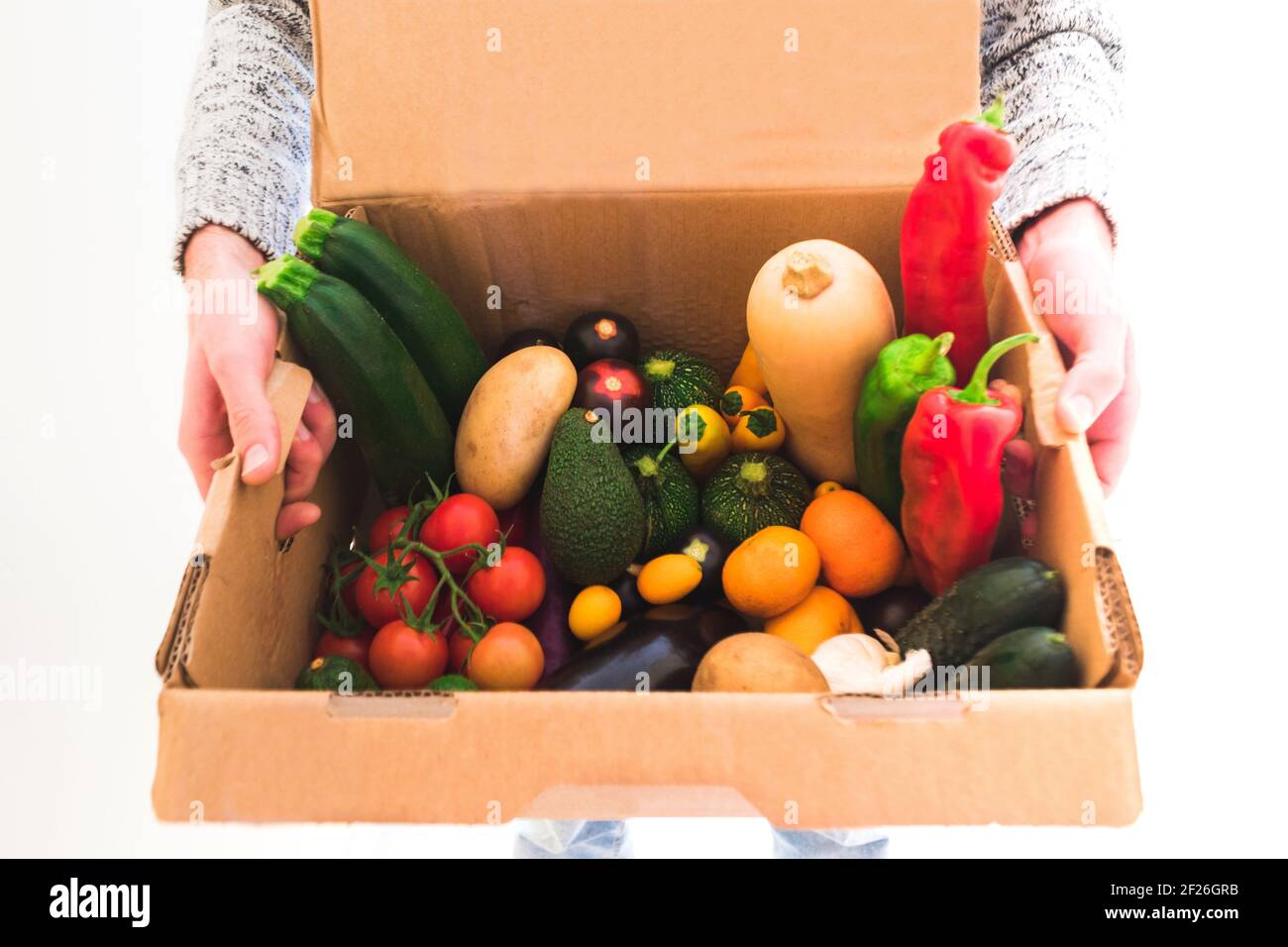 delivery man with a box of ecological fruits and vegetables Stock Photo ...