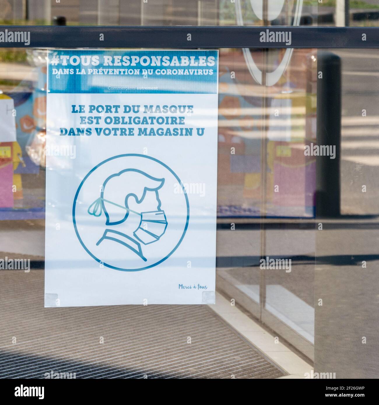 Poster "Wearing a compulsory mask" at the entrance of a U store in ...