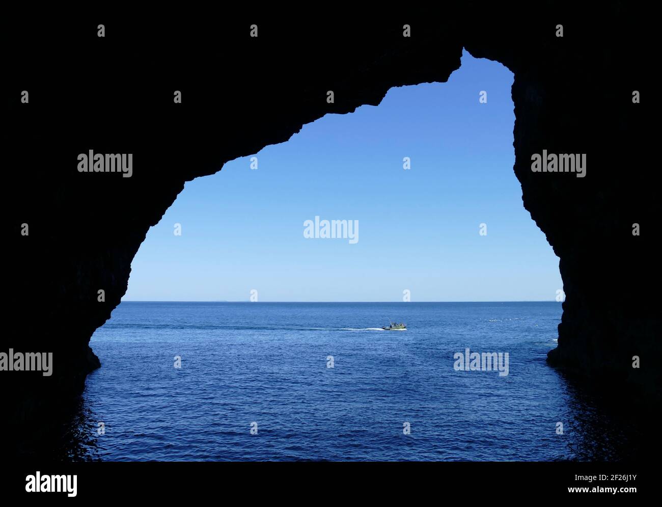 ocean scenery seen through a rock gate at the Bay of Islands, an area ...