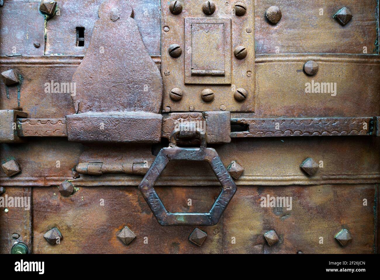 Old rusty door and sliding bolt in Citta Alta Bergamo Stock Photo - Alamy