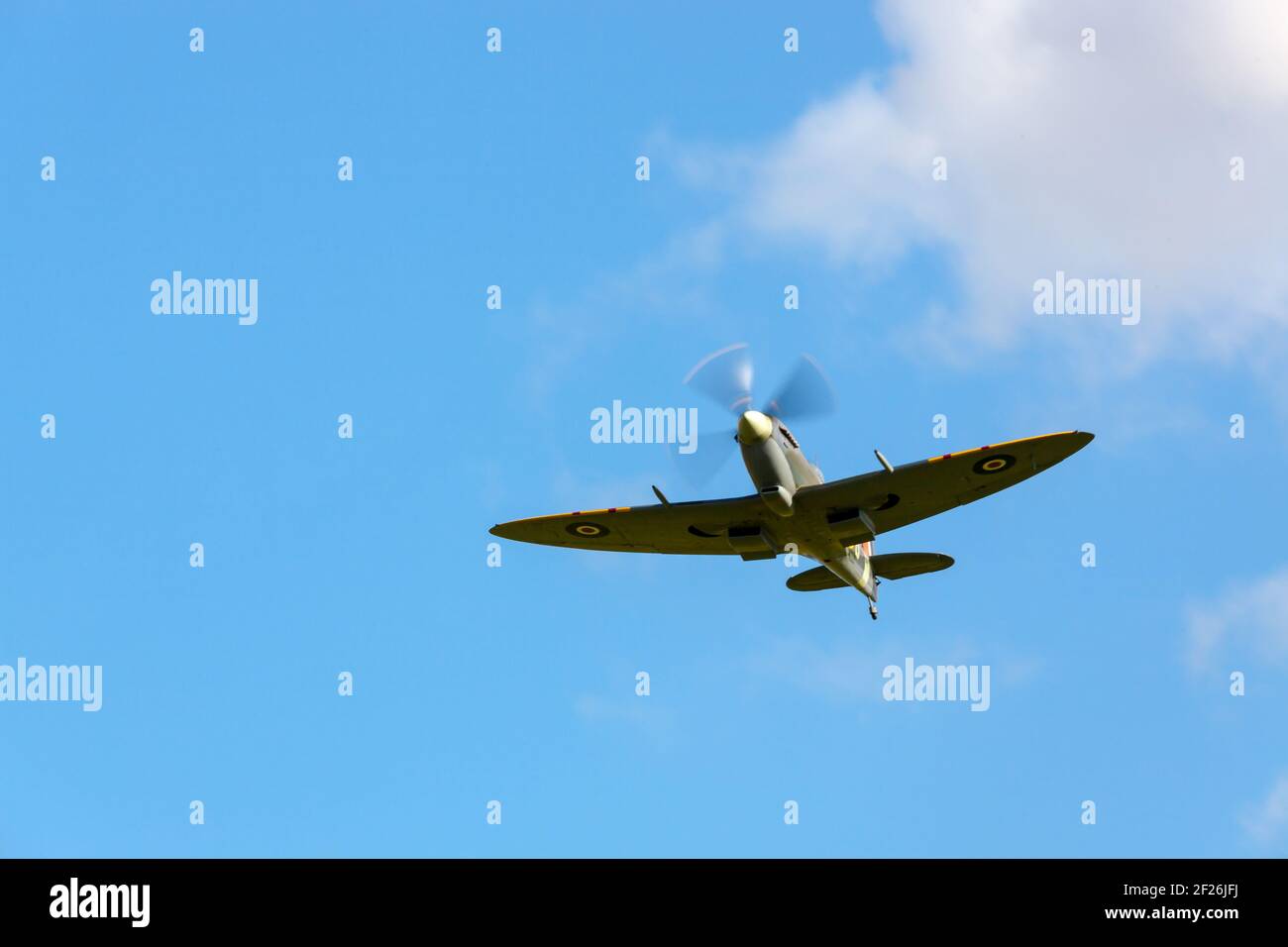 Supermarine Spitfire Flying at the Goodwood Revival Stock Photo - Alamy