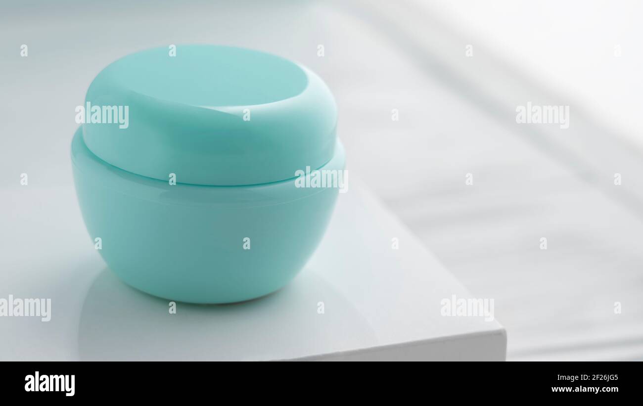 Front view of blue lotion container on white with copy space Stock ...