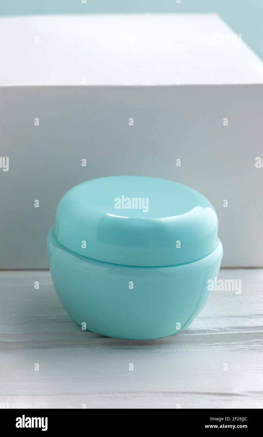 Blue lotion cream container and blank white box Stock Photo - Alamy