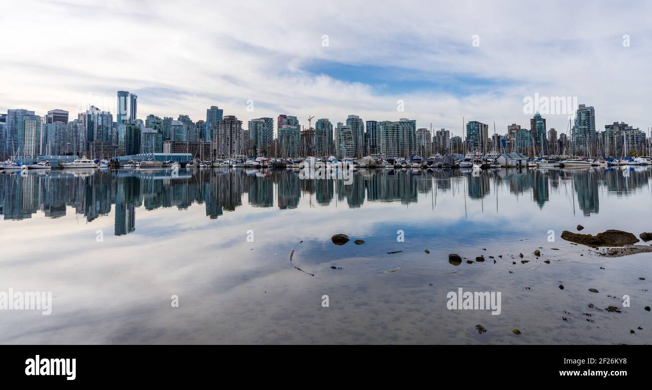 Vancouver City skyline reflected on the water surface. Beautiful ...