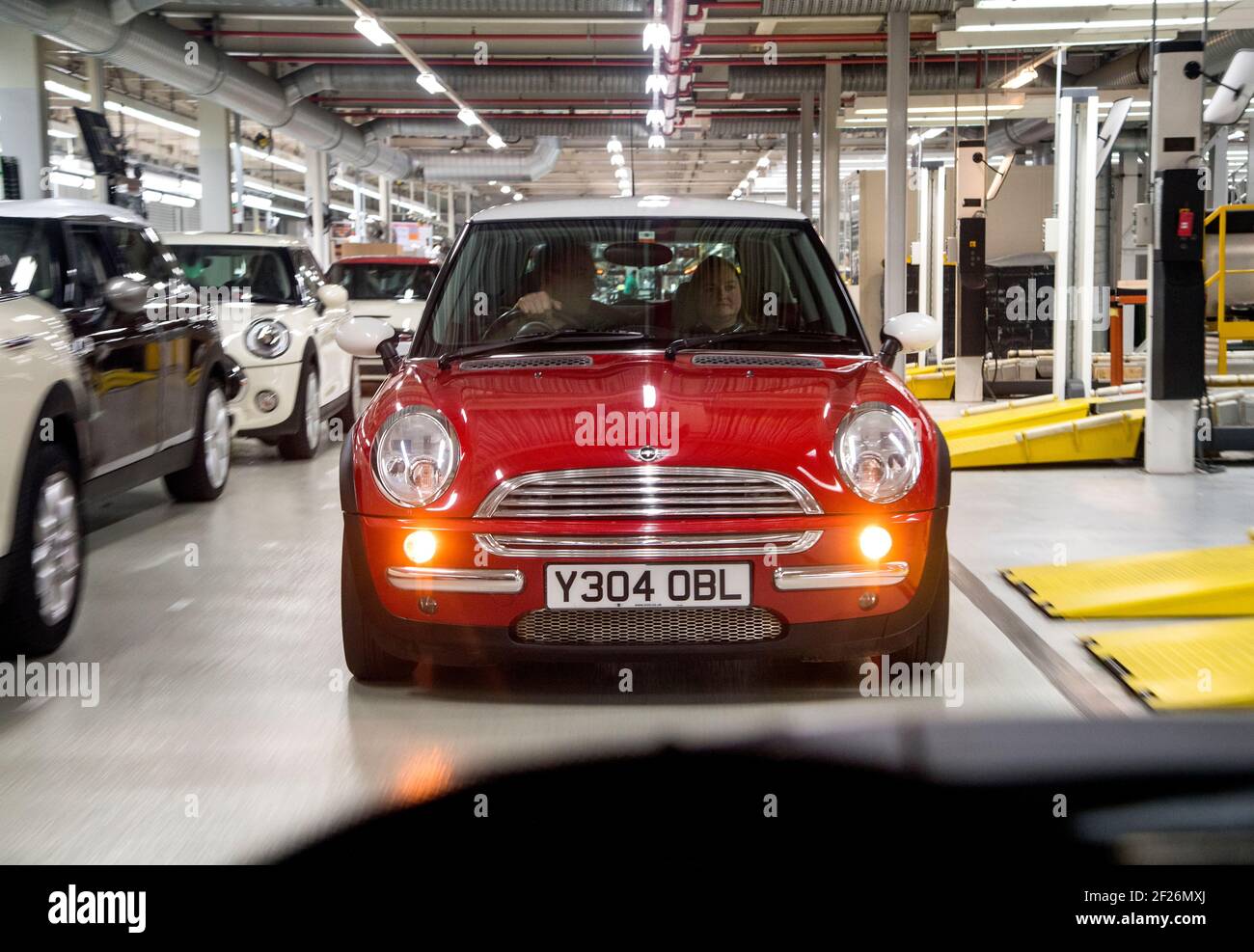 Early 2001 pre-production R50 shape BMW MINI Cooper driving through the ...