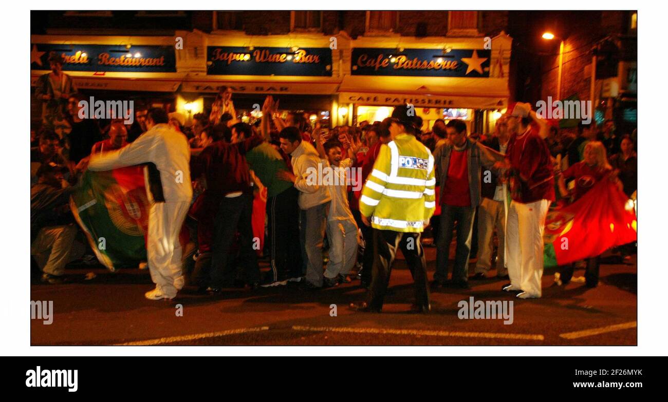 Portugese fans celebrate their win against England in Euro 2004 outside ...