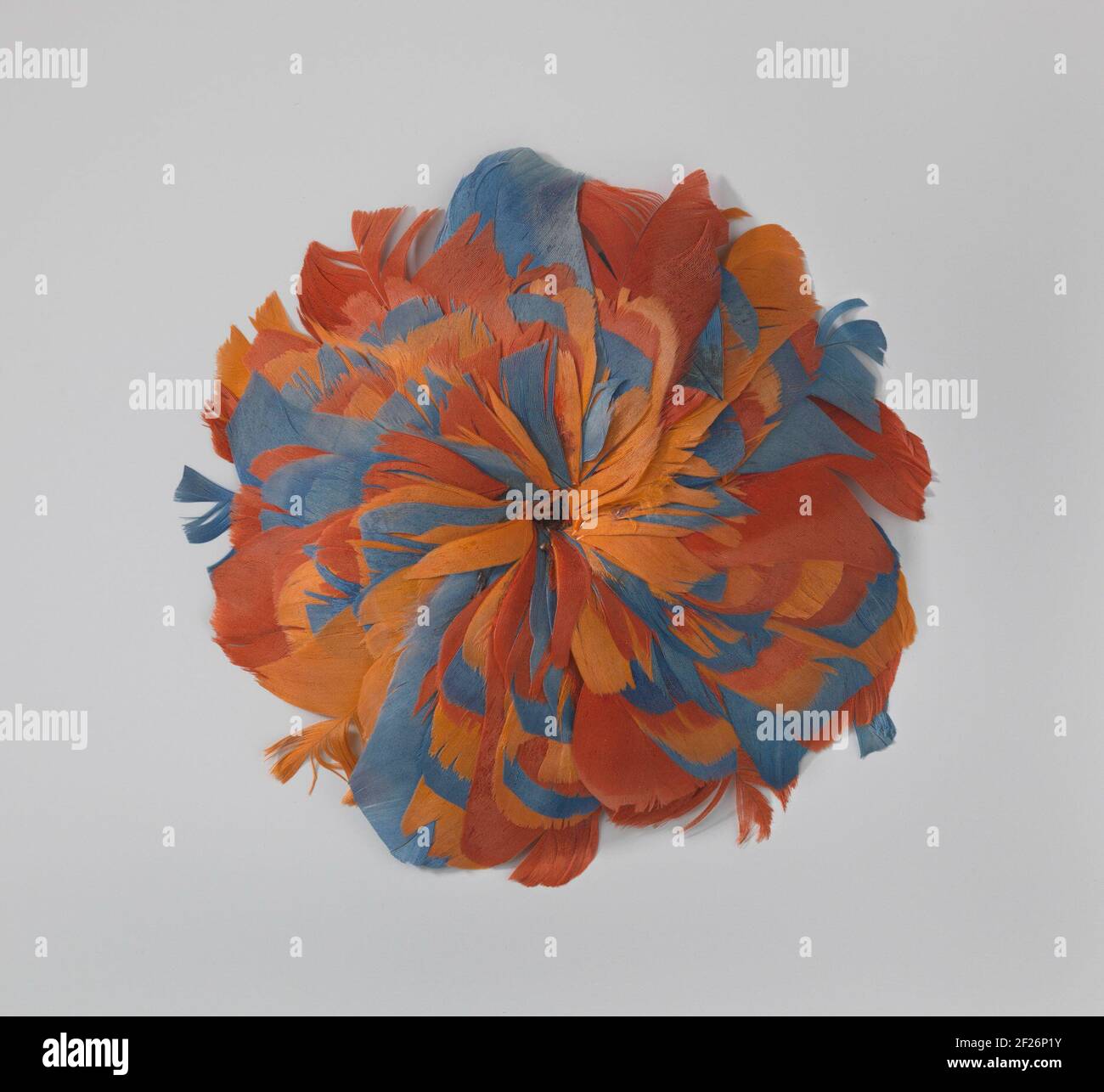Cookward of feathers in the colors orange and blue in the form of a ...