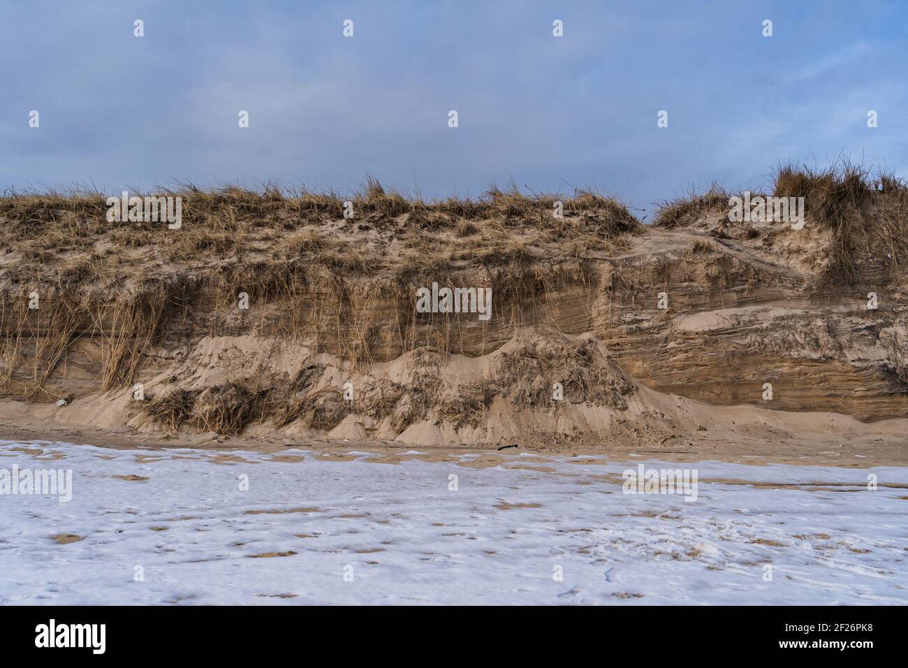 Close up of the sand dunes in Montauk, with snow covering the sand ...