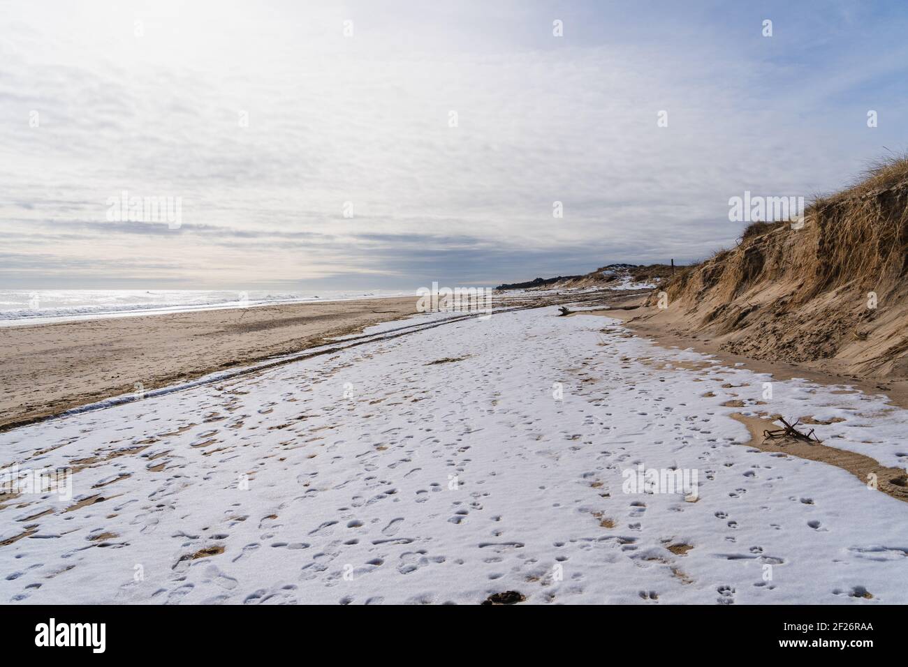 A bed of snow on the beach in Montauk during sunset Stock Photo - Alamy