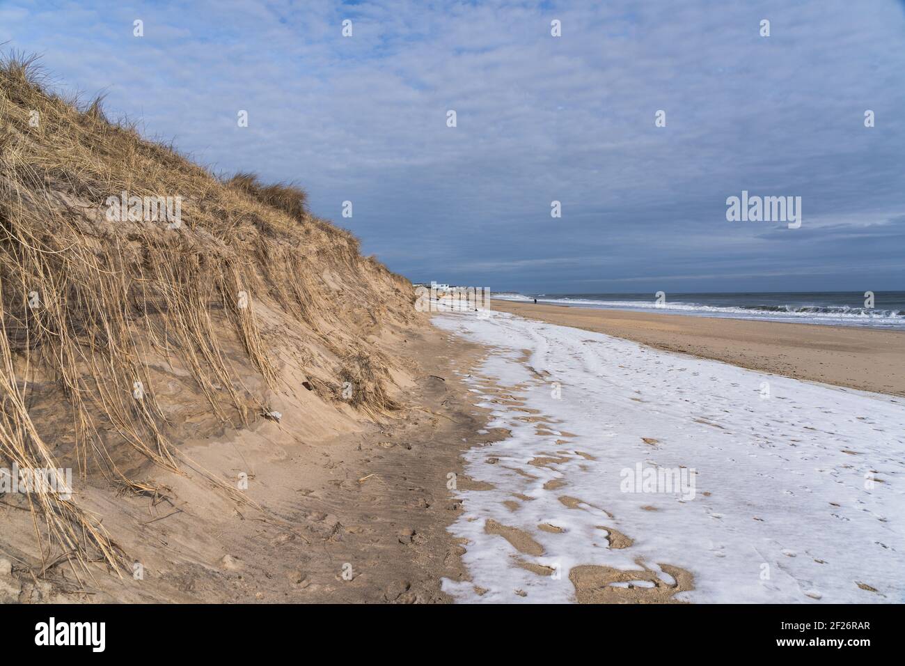 The beach in Montauk during the Winter, with snow covering part of the ...