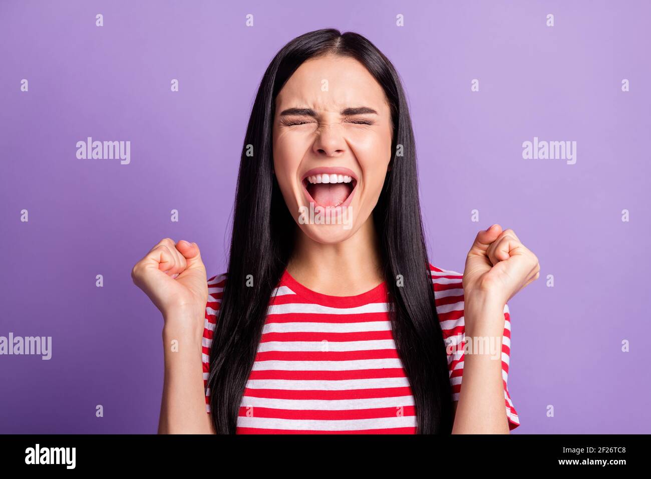 Photo of funny astonished lady open mouth raise fists eyes closed wear ...