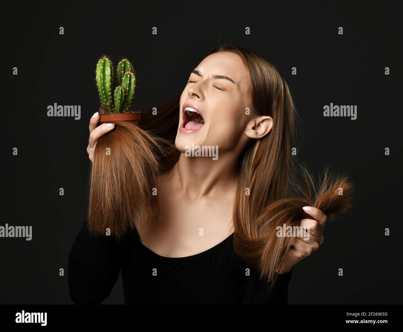 Frustrated woman with long silky straight hair in black body screaming ...