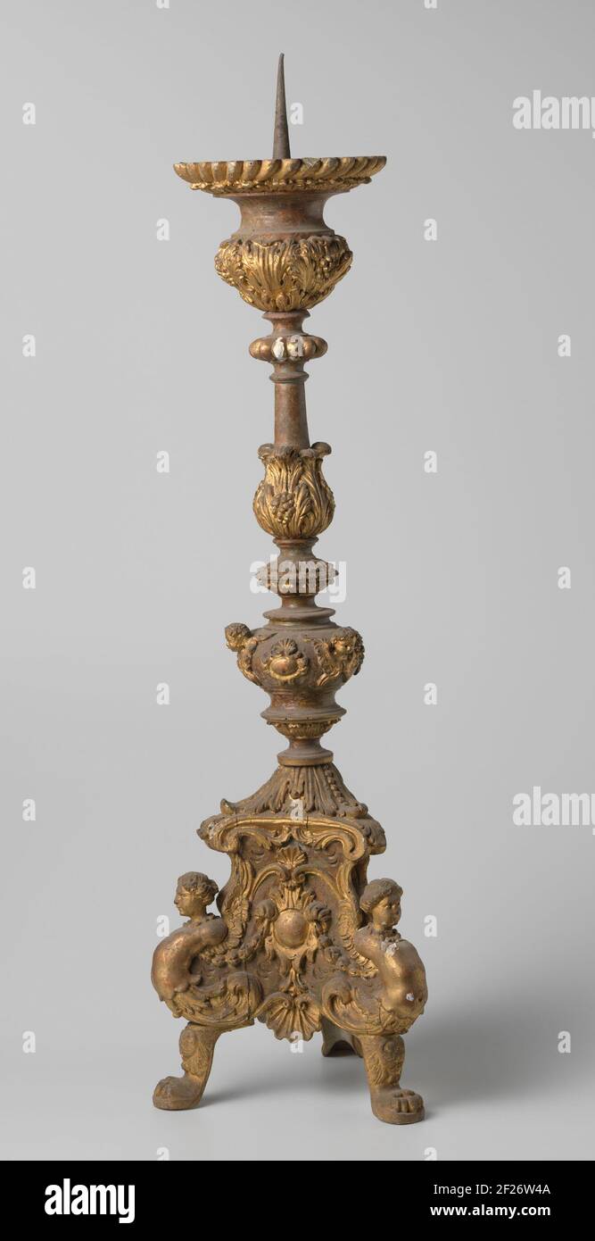 Church candlestick. Large wooden carved church candlestick, standing on ...