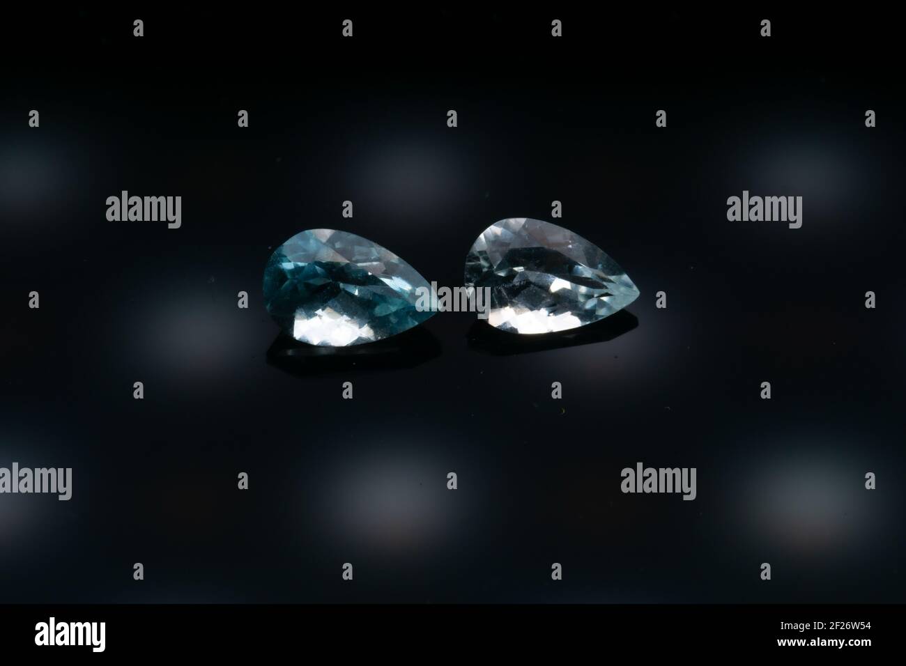 Natural stone blue topaz on a black background Stock Photo - Alamy