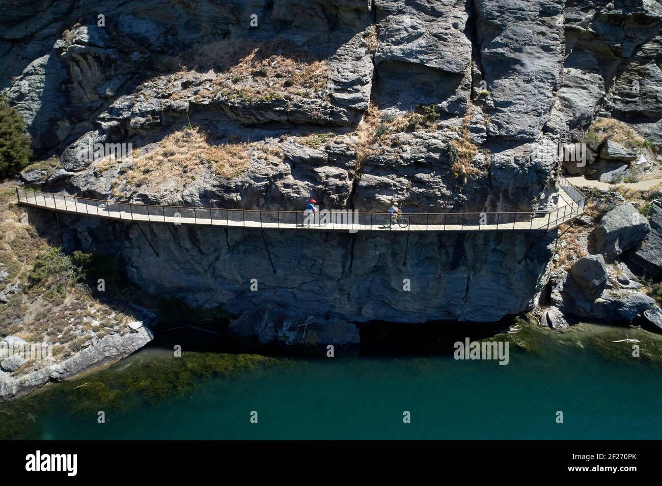 Cyclists on cantilever bridge on Lake Dunstan Cycle Trail, and Lake ...