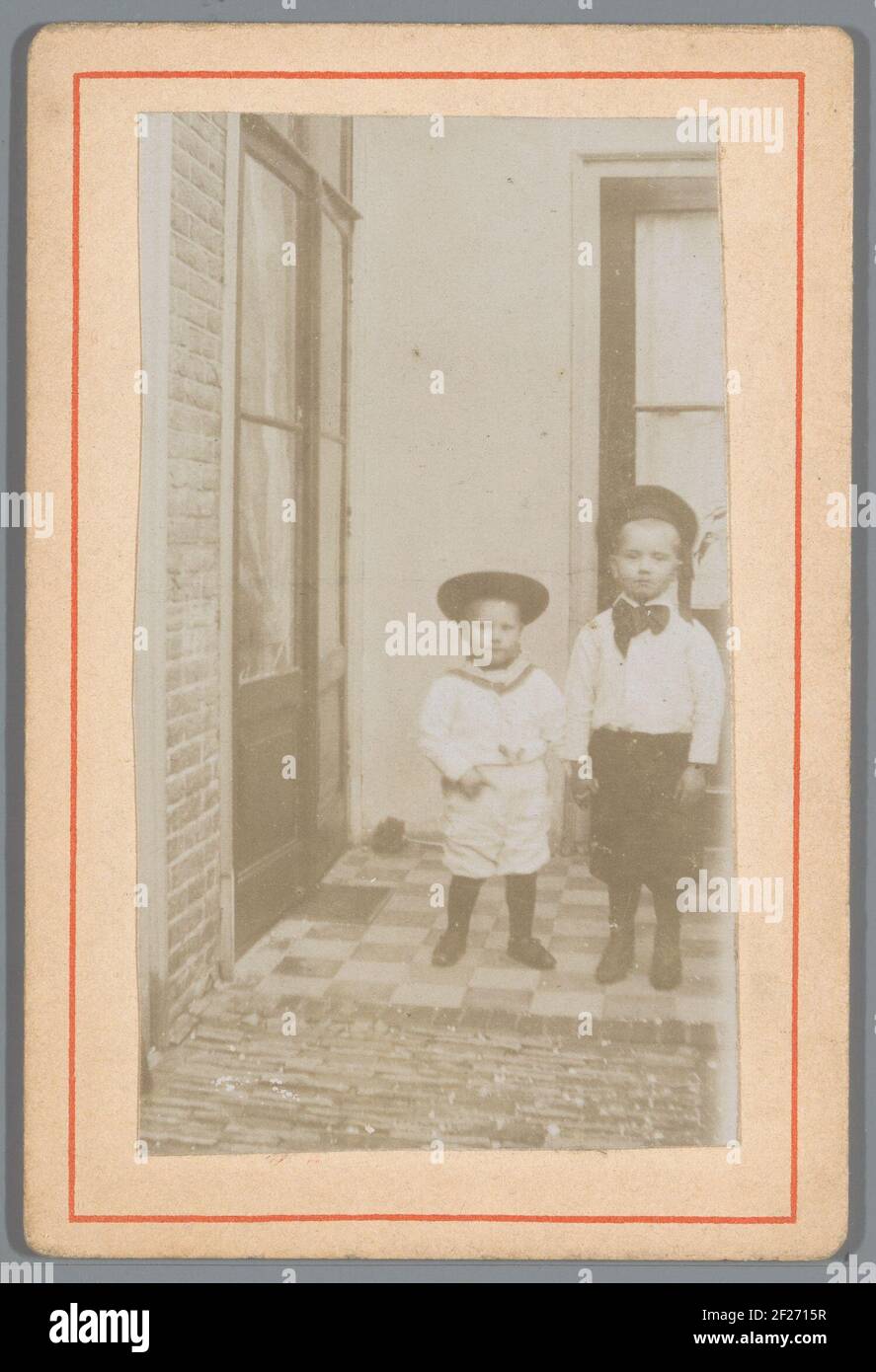 Portrait of two unknown children in a courtyard Stock Photo - Alamy