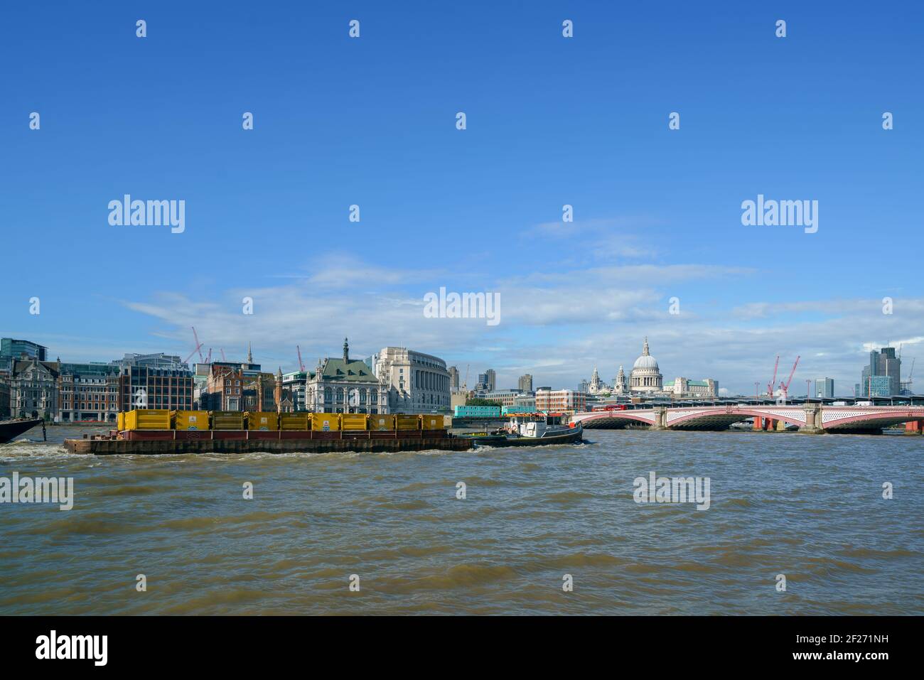 LONDON - JULY 27 : Recovery tug travelling down the River Thames ...
