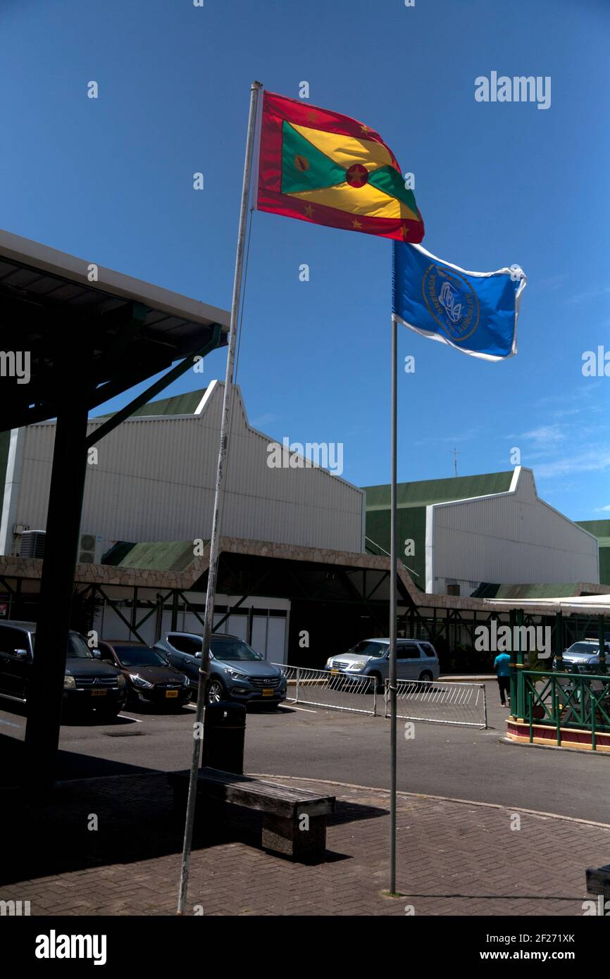flags outside maurice bishop international airport st george grenada ...