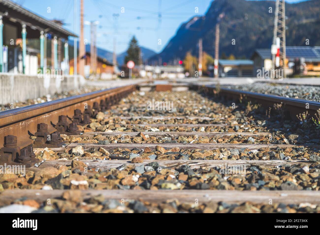 Sustainable traveling by train: Rail track and colorful, idyllic ...